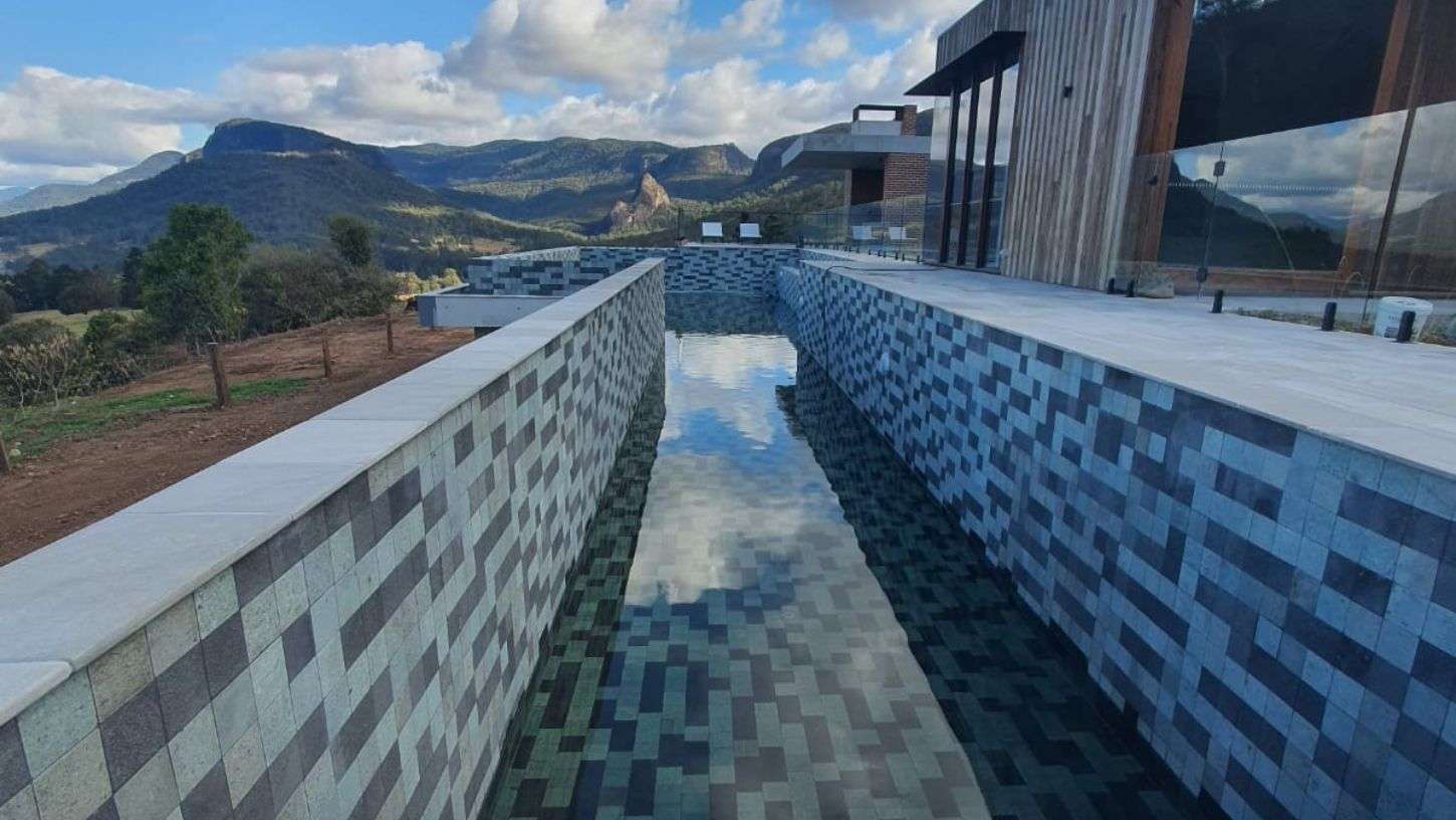 The Elegance of Green Sukabumi Stone & Black Lavastone Swimming Pool
