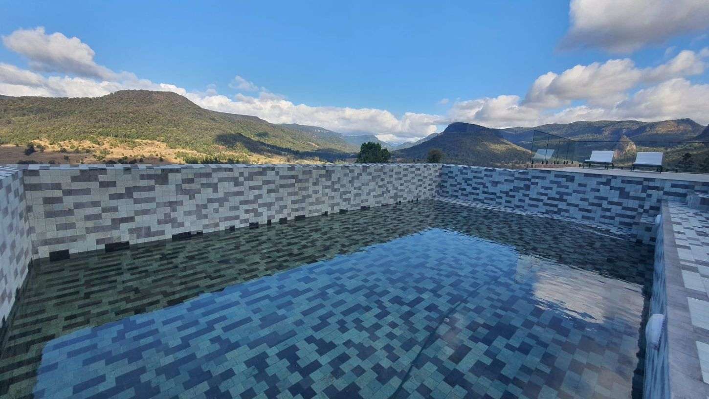 The Elegance of Green Sukabumi Stone & Black Lavastone Swimming Pool